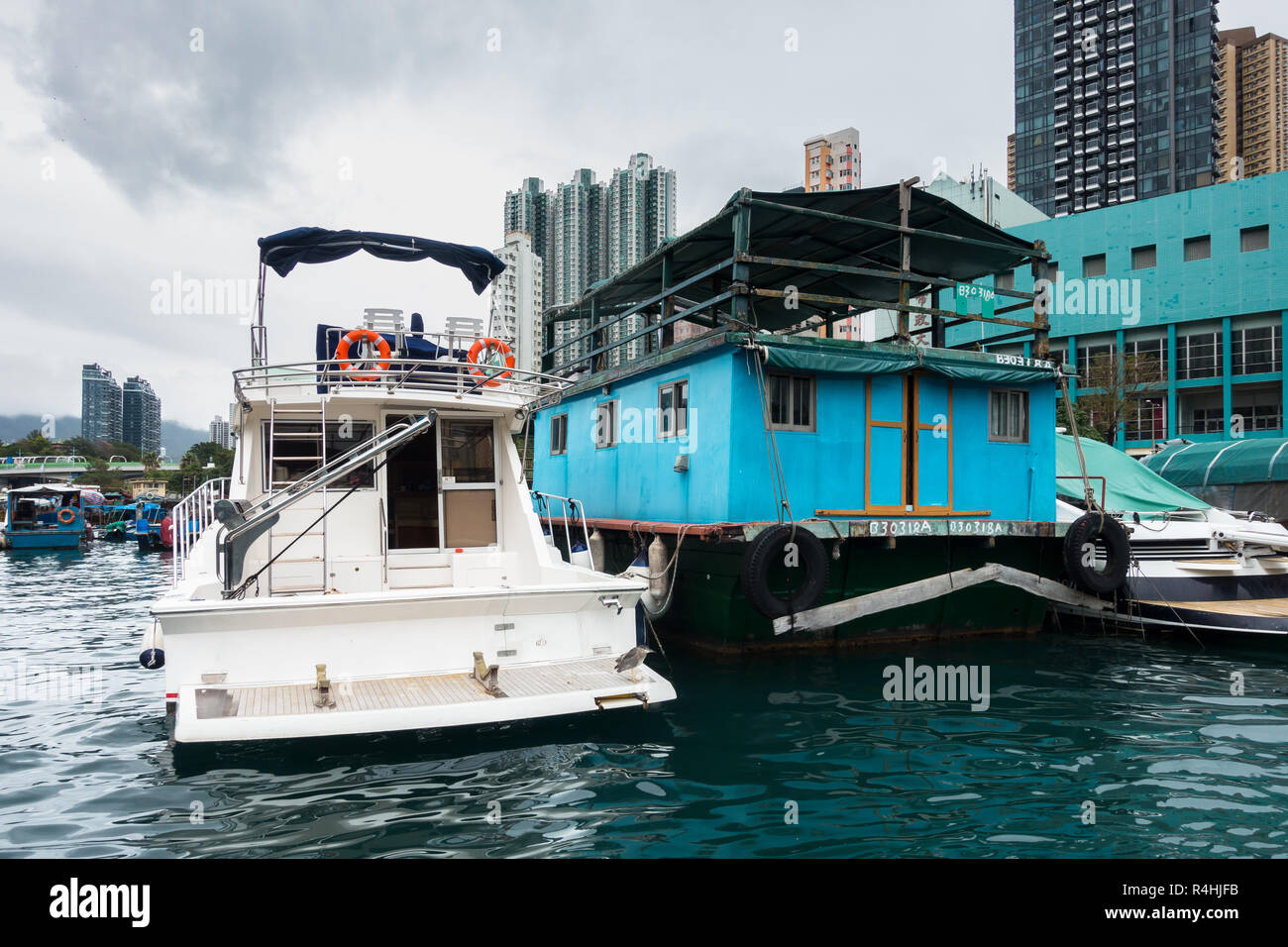 Typical house boats at the Aberdeen floating village, located in ...