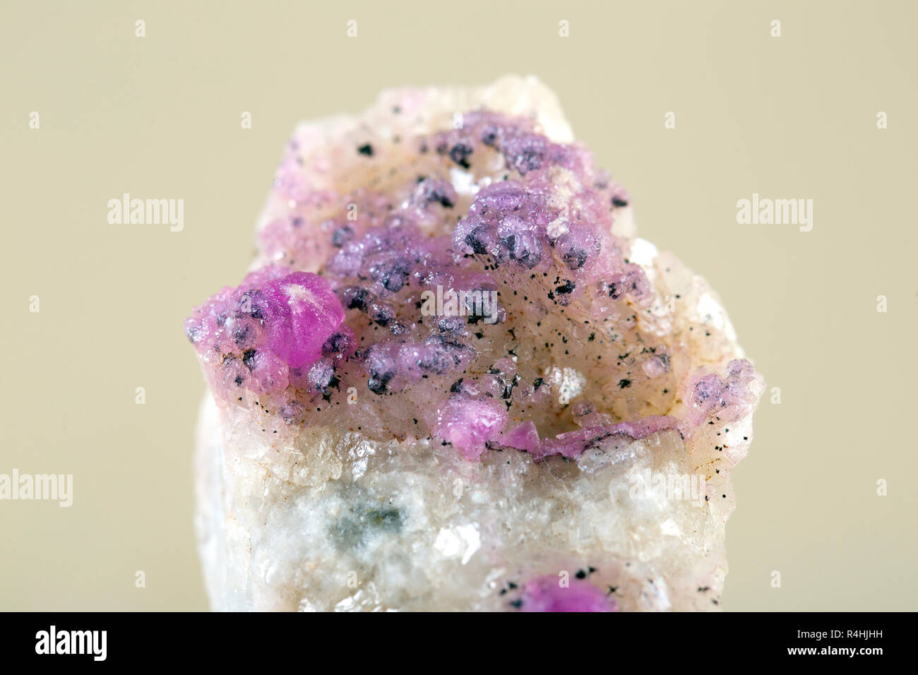 Macro mineral stone Cobalt Calcite rock on white background close up ...