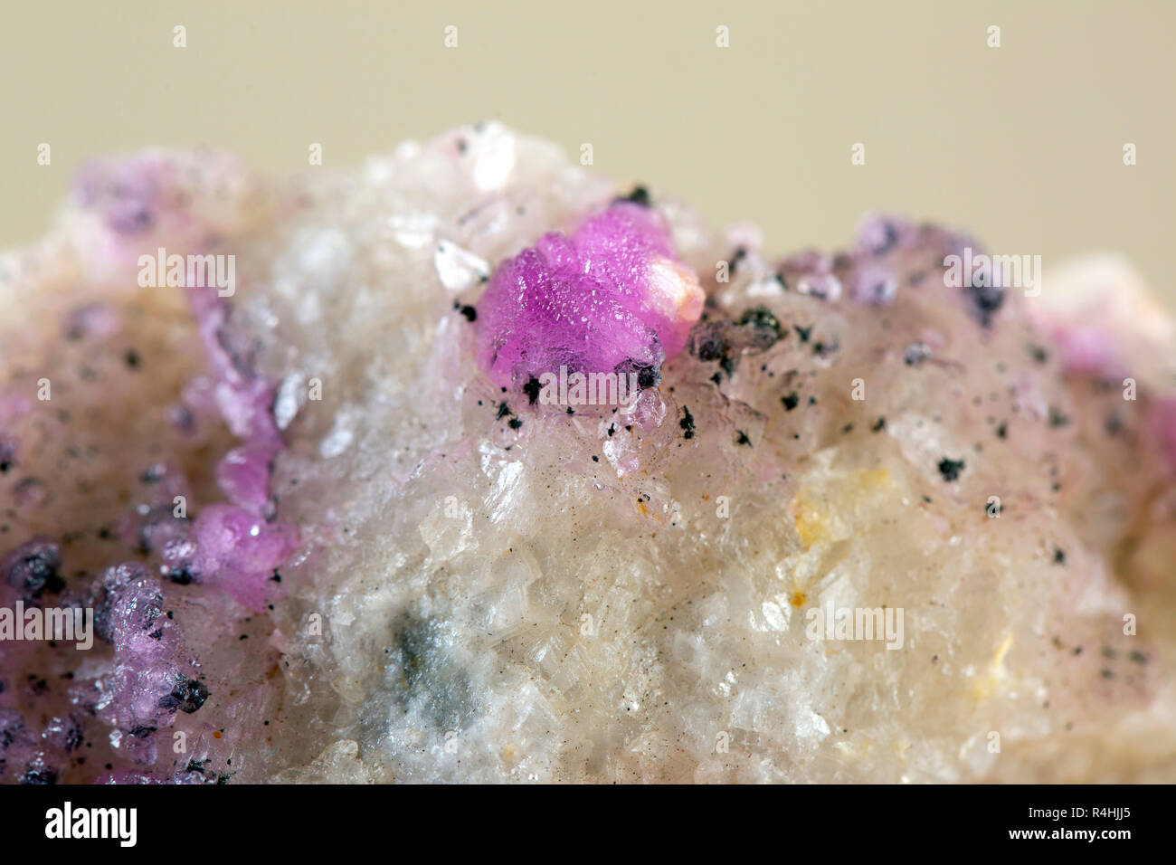 Macro mineral stone Cobalt Calcite rock on white background close up ...