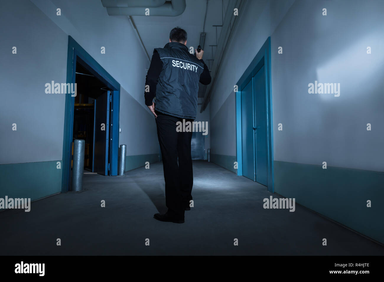 Security Guard Standing In Corridor Of Building Stock Photo - Alamy