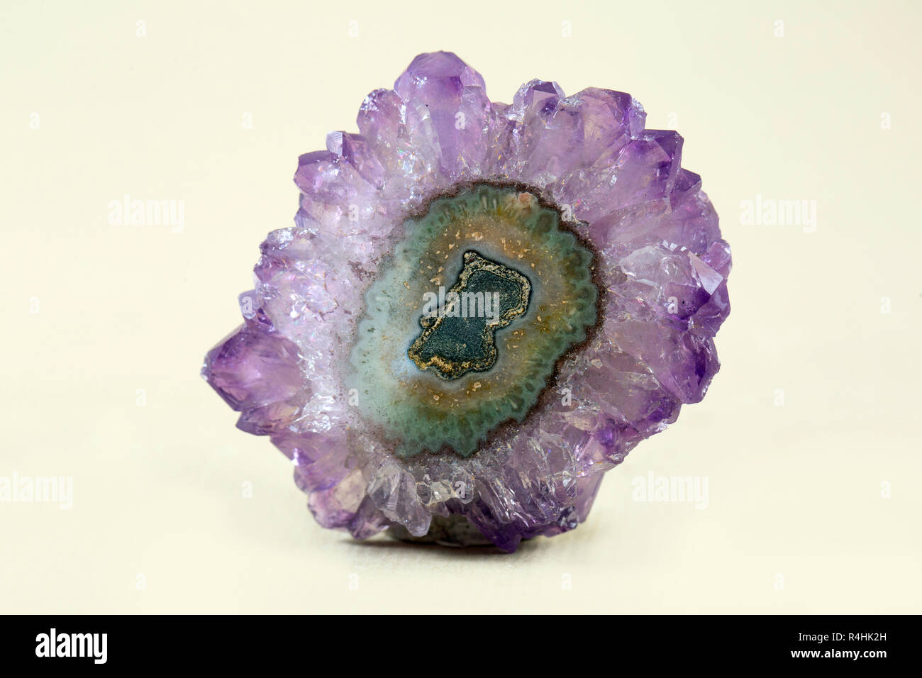 A banded Agate specimen with a geode of Quartz crystals Stock Photo - Alamy