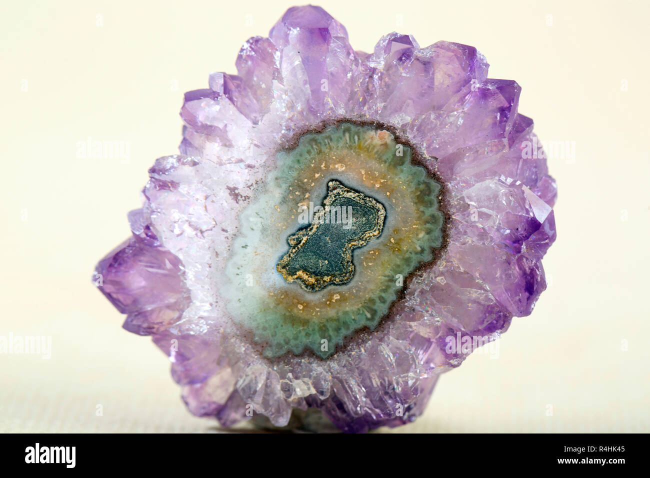 A banded Agate specimen with a geode of Quartz crystals Stock Photo - Alamy