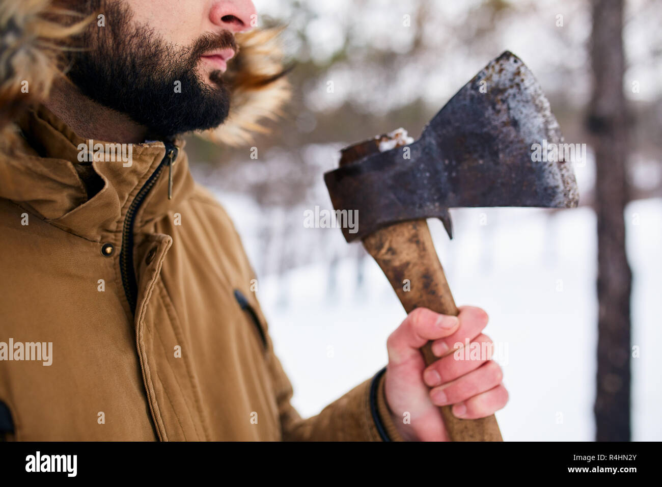 Beard and axe. Lumberjack standing with weathered rusty axe in his hand ...