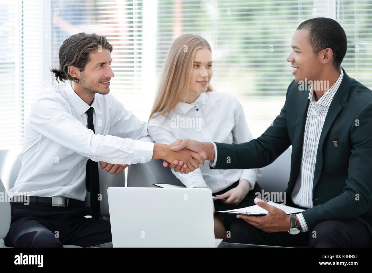 business partners greeting each other with a handshake Stock Photo - Alamy