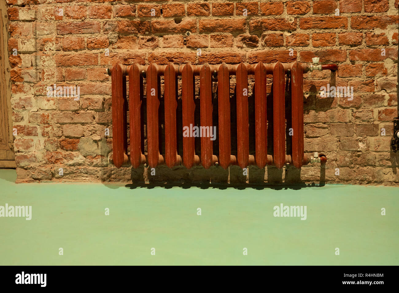 the iron battery rusty about a brick wall old and destroyed Stock Photo ...