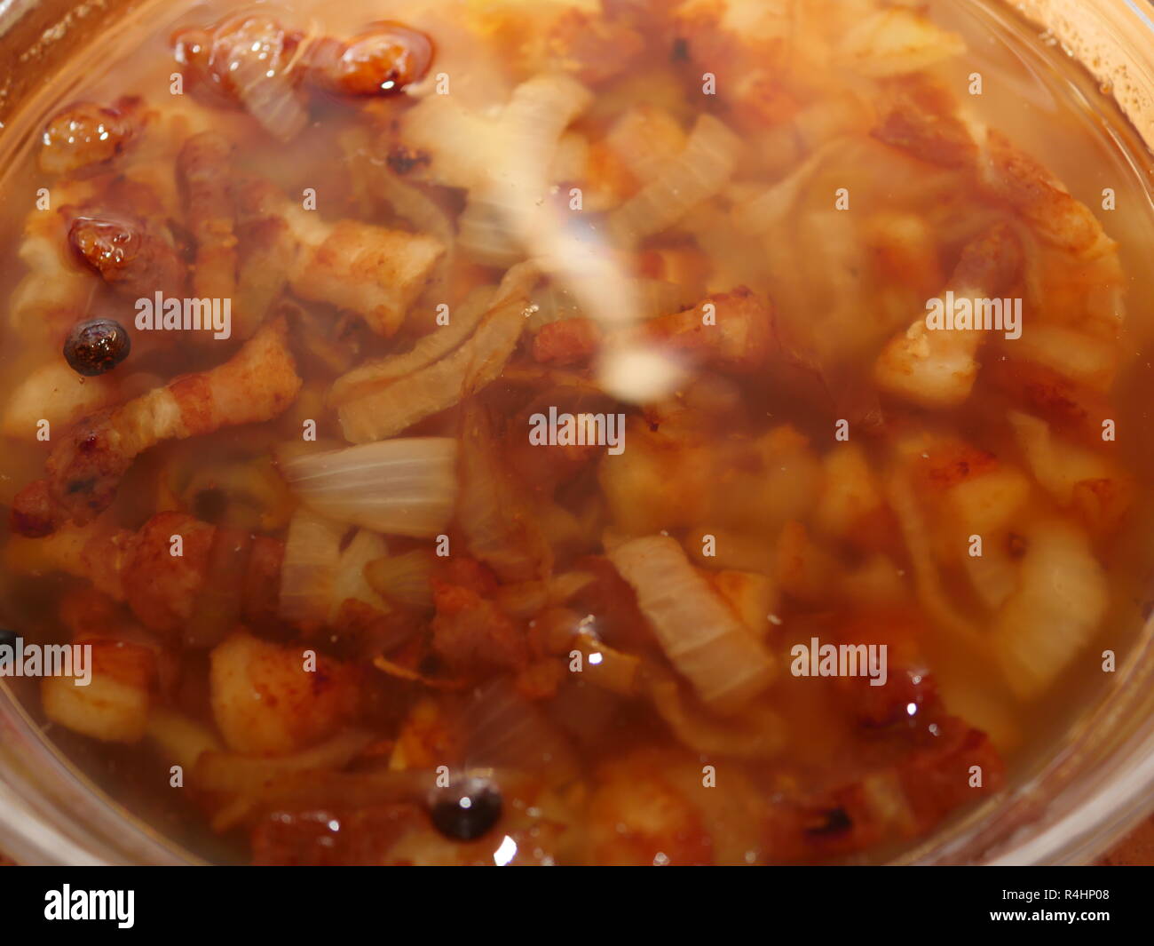 hot liquid lard in a clay pot with spices Stock Photo - Alamy