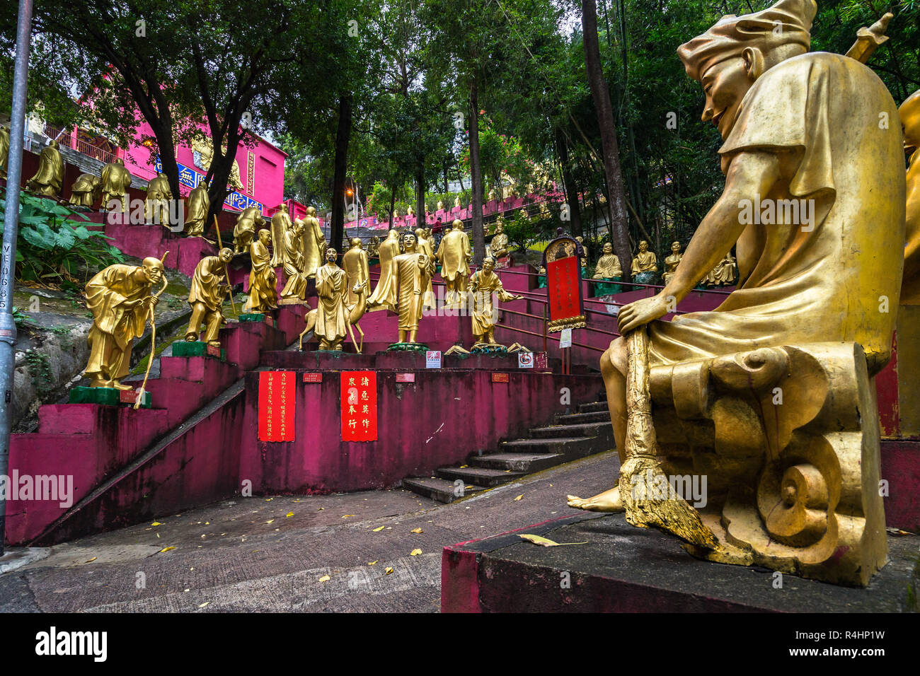 Lifesize Buddha statues, each one with different poses, along the ...