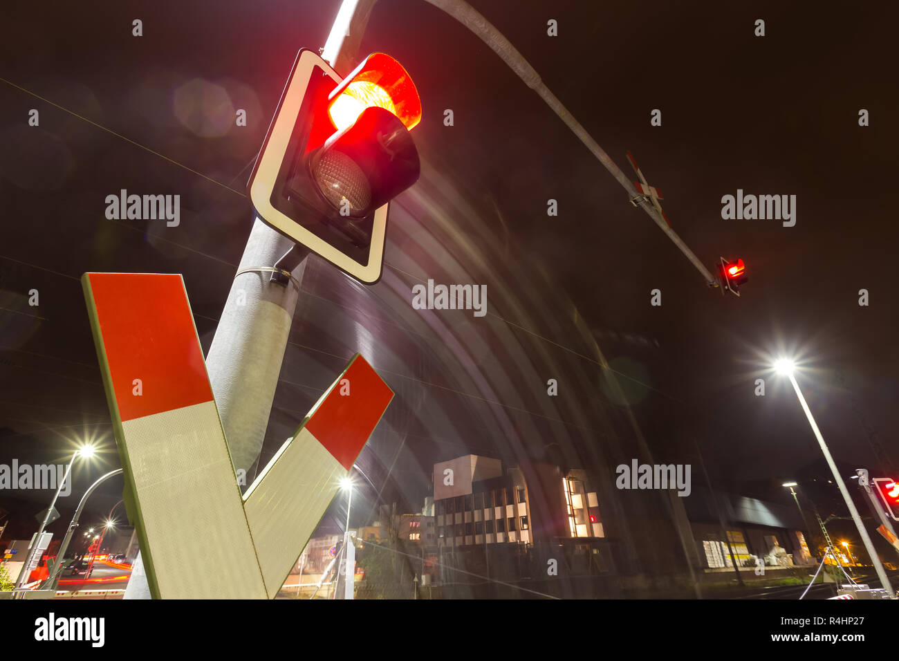 closed railroad crossing with red warning light at night Stock Photo ...