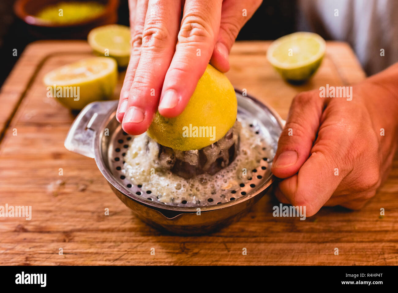 Female hand squeezing fresh lemon hi-res stock photography and images ...