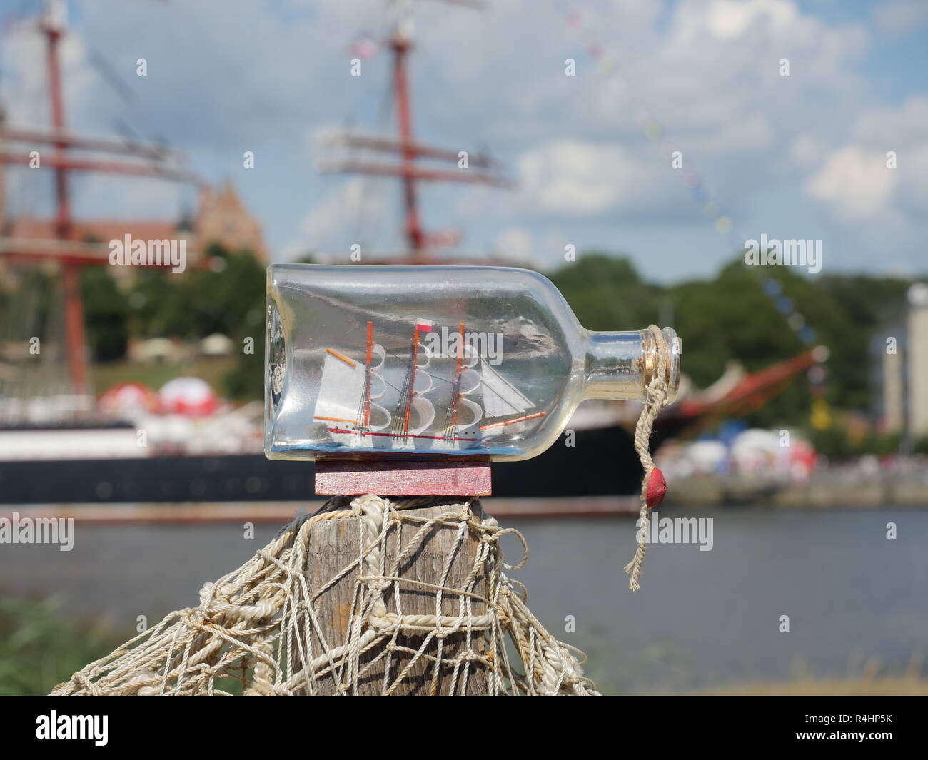 sailcloth ship in closed with cork bottle on harbor background Stock ...
