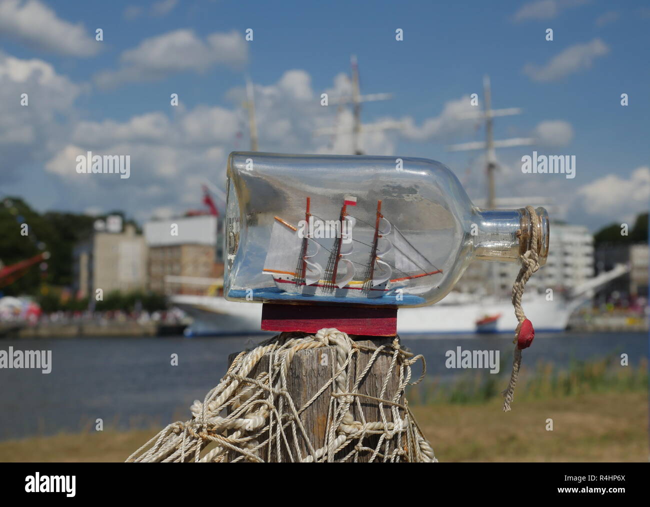 sailcloth ship in closed with cork bottle on harbor background Stock ...