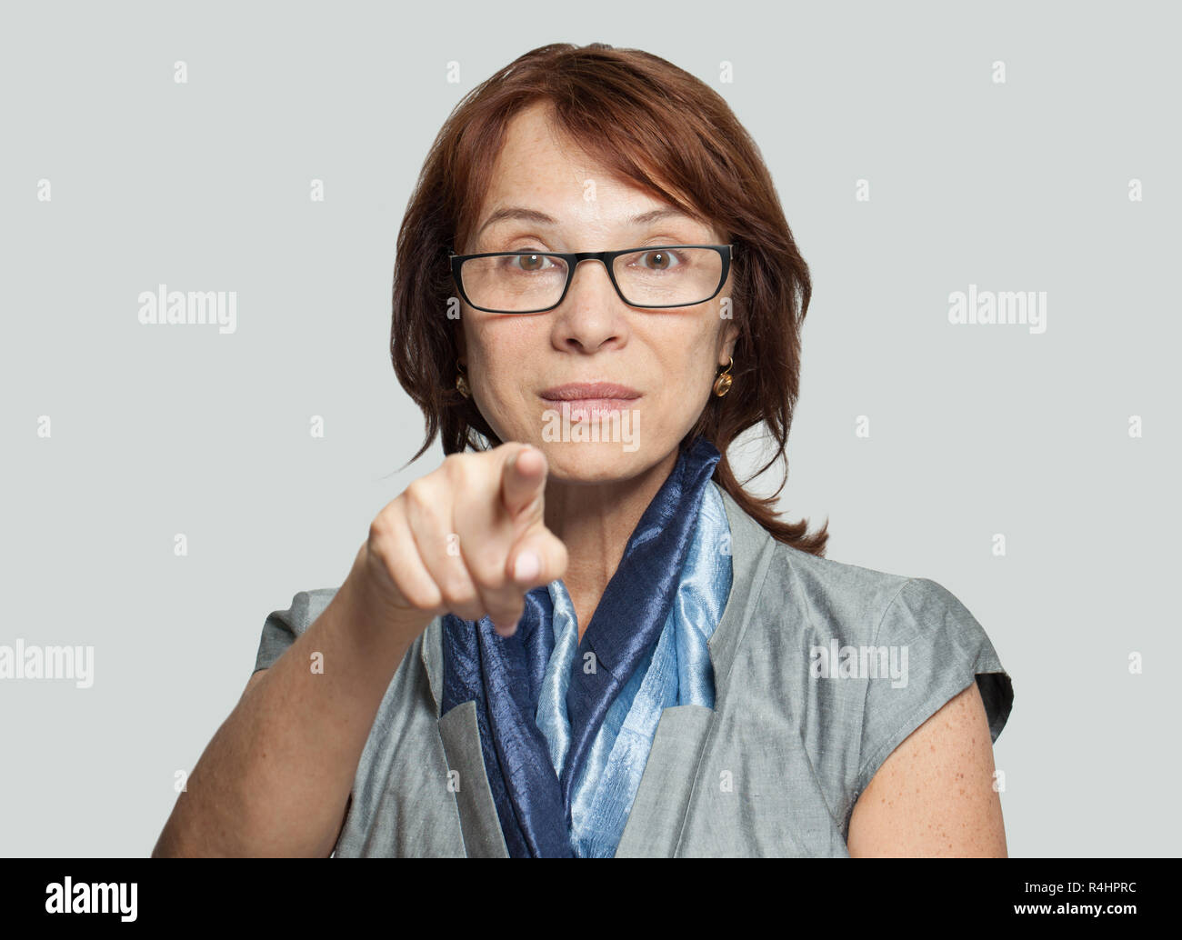 Business woman pointing on white background Stock Photo - Alamy