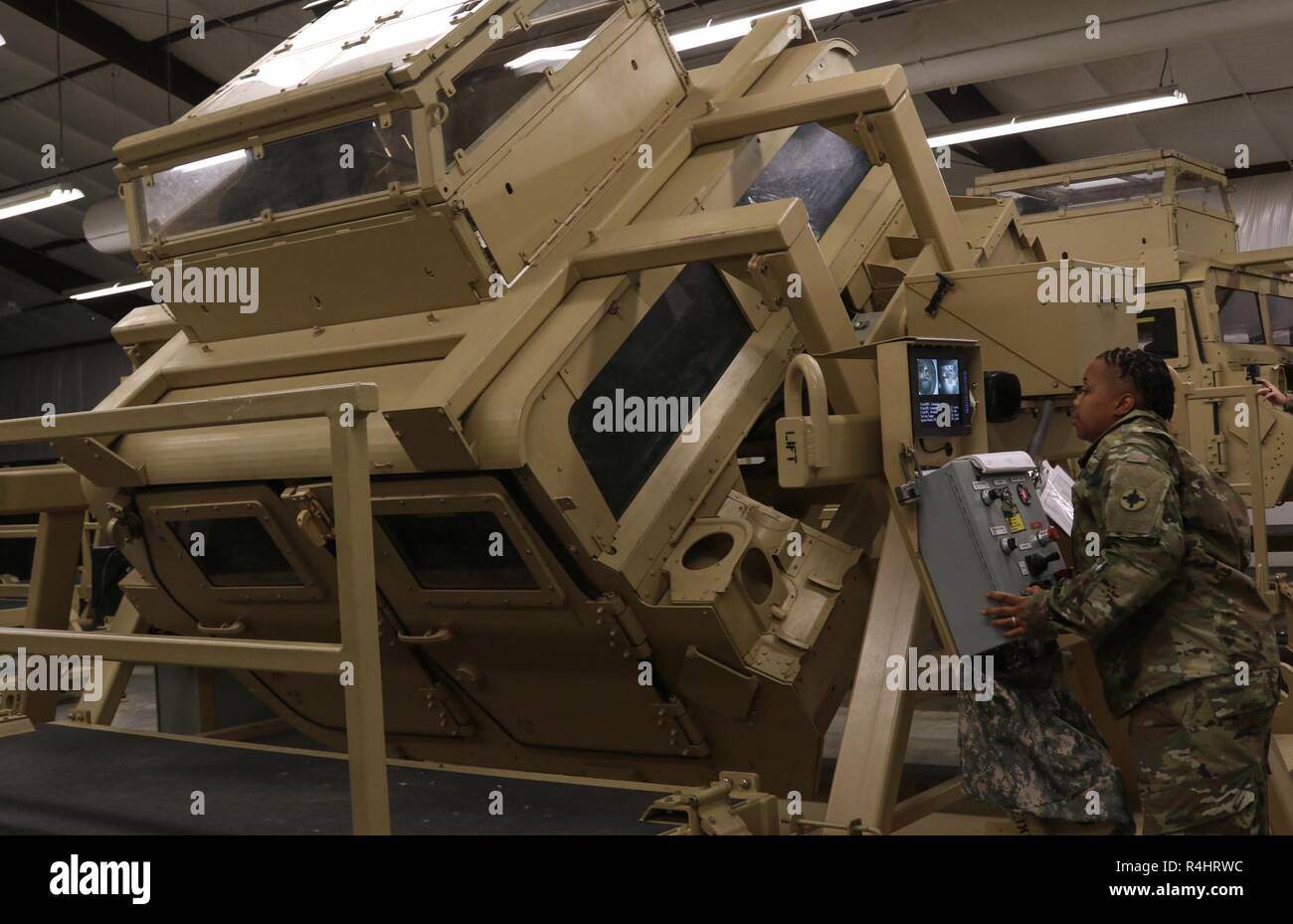 Spc. Shantel D. Jones, 184th Sustainment Command, controls the HMMWV ...