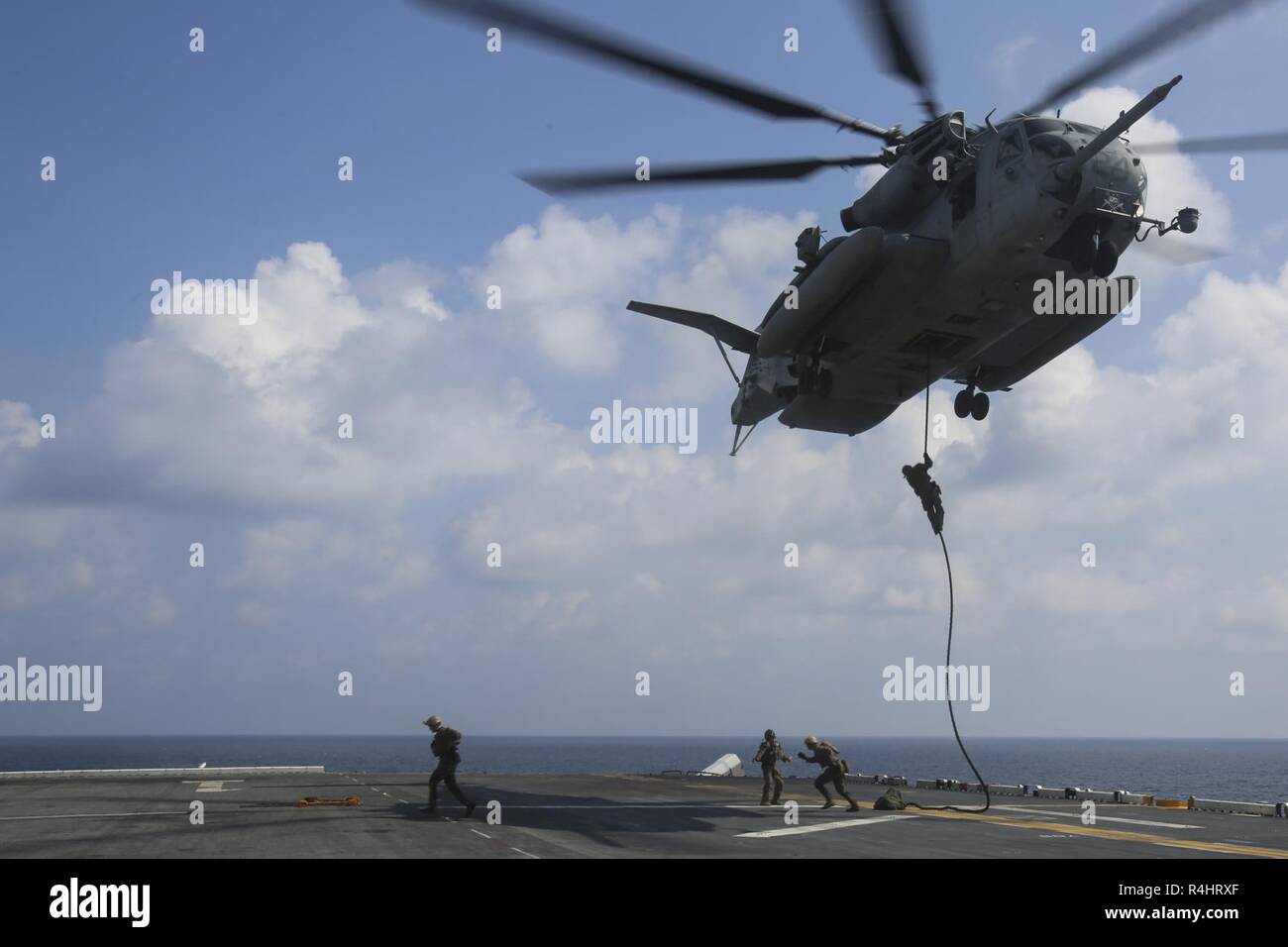 Marines with the 31st Marine Expeditionary Unitfast rope from a CH-53E ...