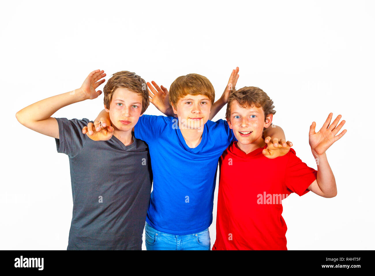 three happy joyful friends in blue, red and black Stock Photo - Alamy