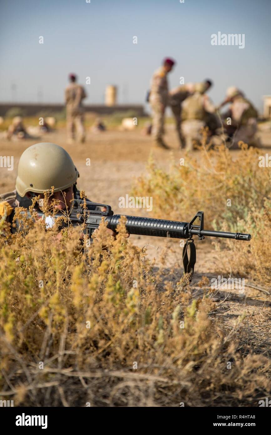 An Iraqi army soldier from 3rd Battalion, 41st Brigade lays in the ...