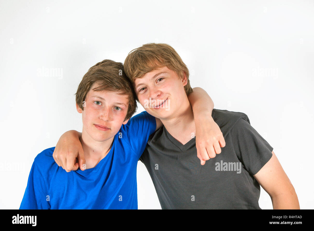two friends hugging and posing Stock Photo - Alamy