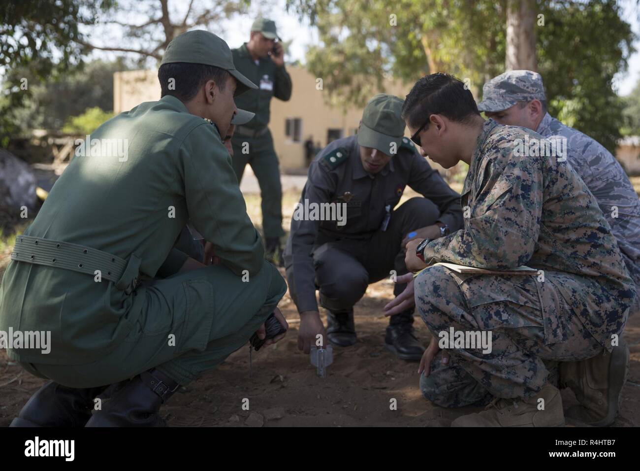 A U.S. Marine advises members of the Moroccan Royal Armed Forces on how ...