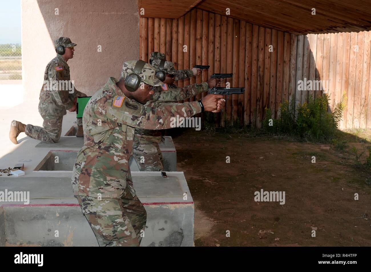US Army Soldiers from NRDC Spain fire an M9 9mm pistol during ...