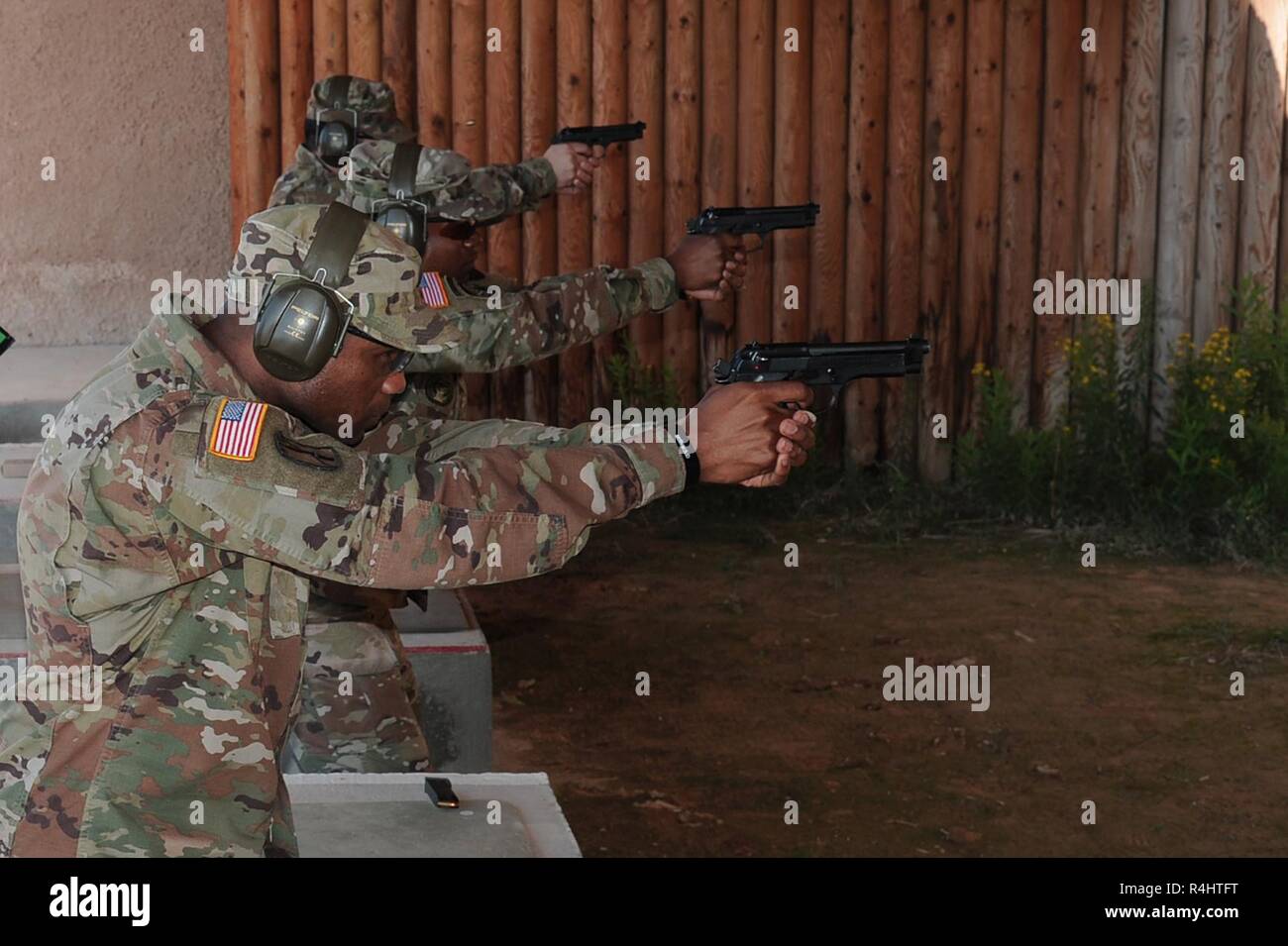 US Army Soldiers from NRDC Spain fire an M9 9mm pistol during ...