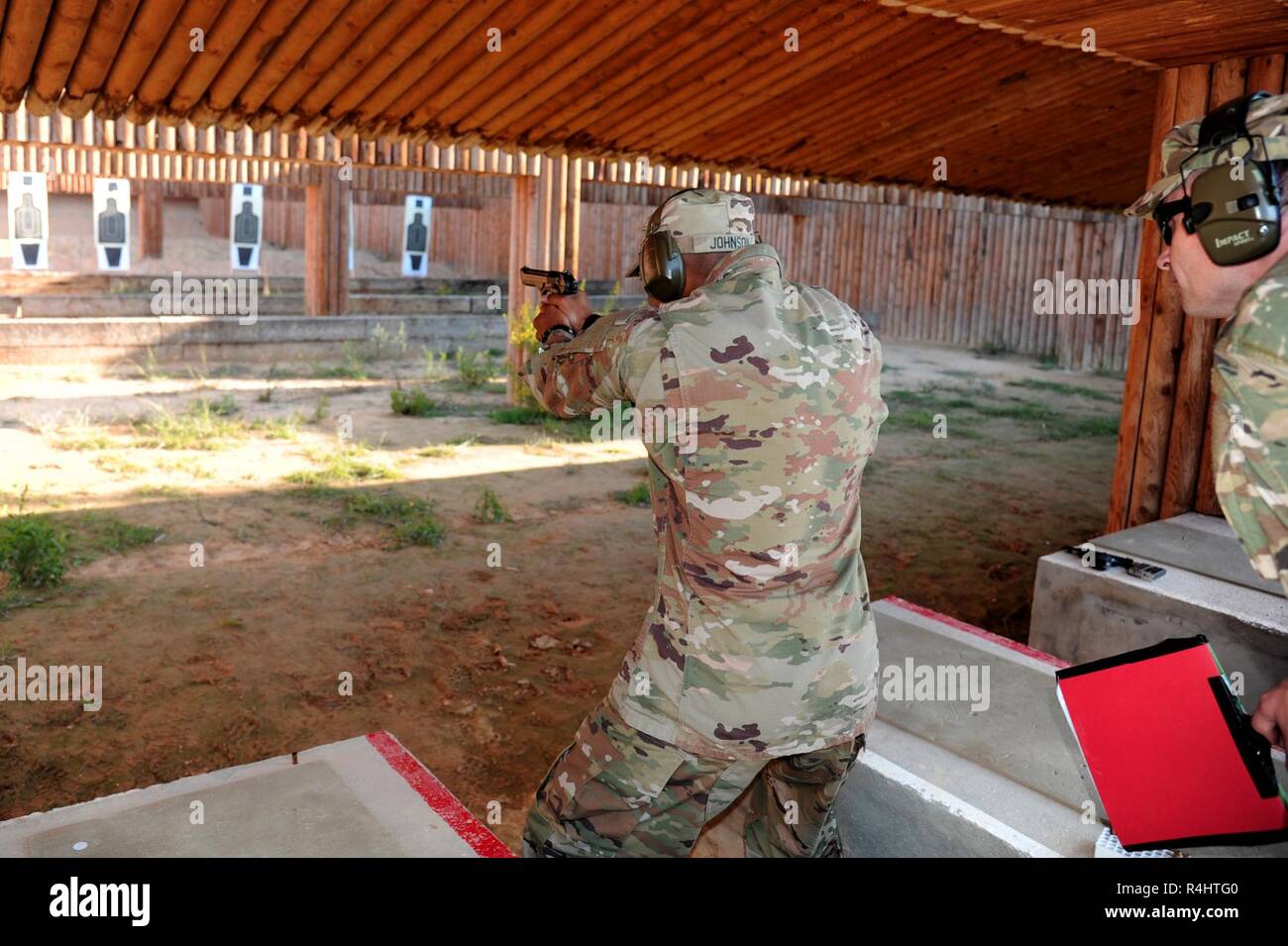 US Army Soldier from NRDC Spain fires an M9 9mm pistol during ...