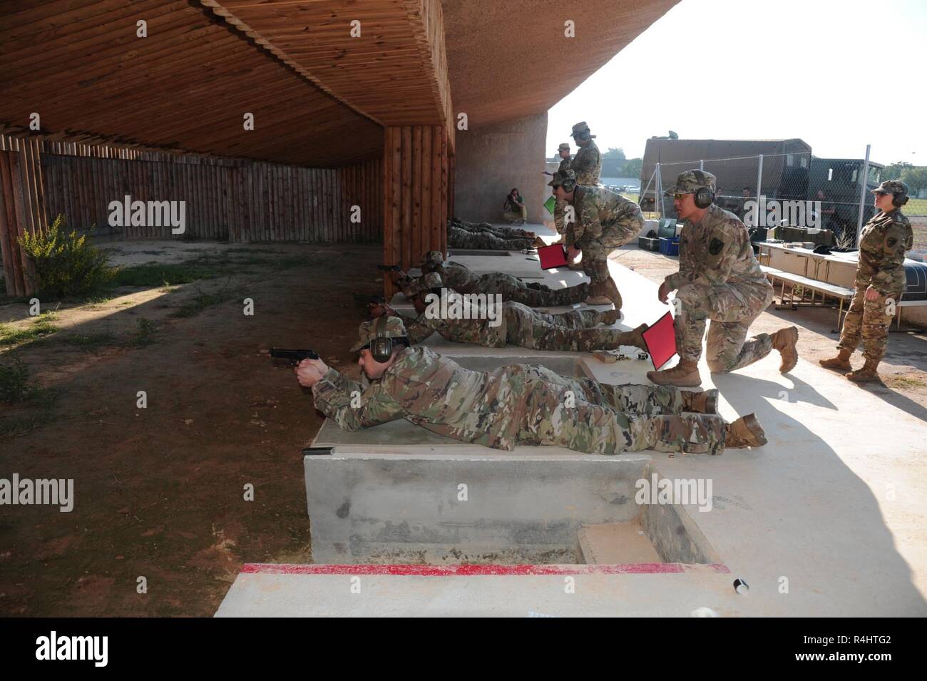 US Army Soldiers from NRDC Spain fire an M9 9mm pistol during ...