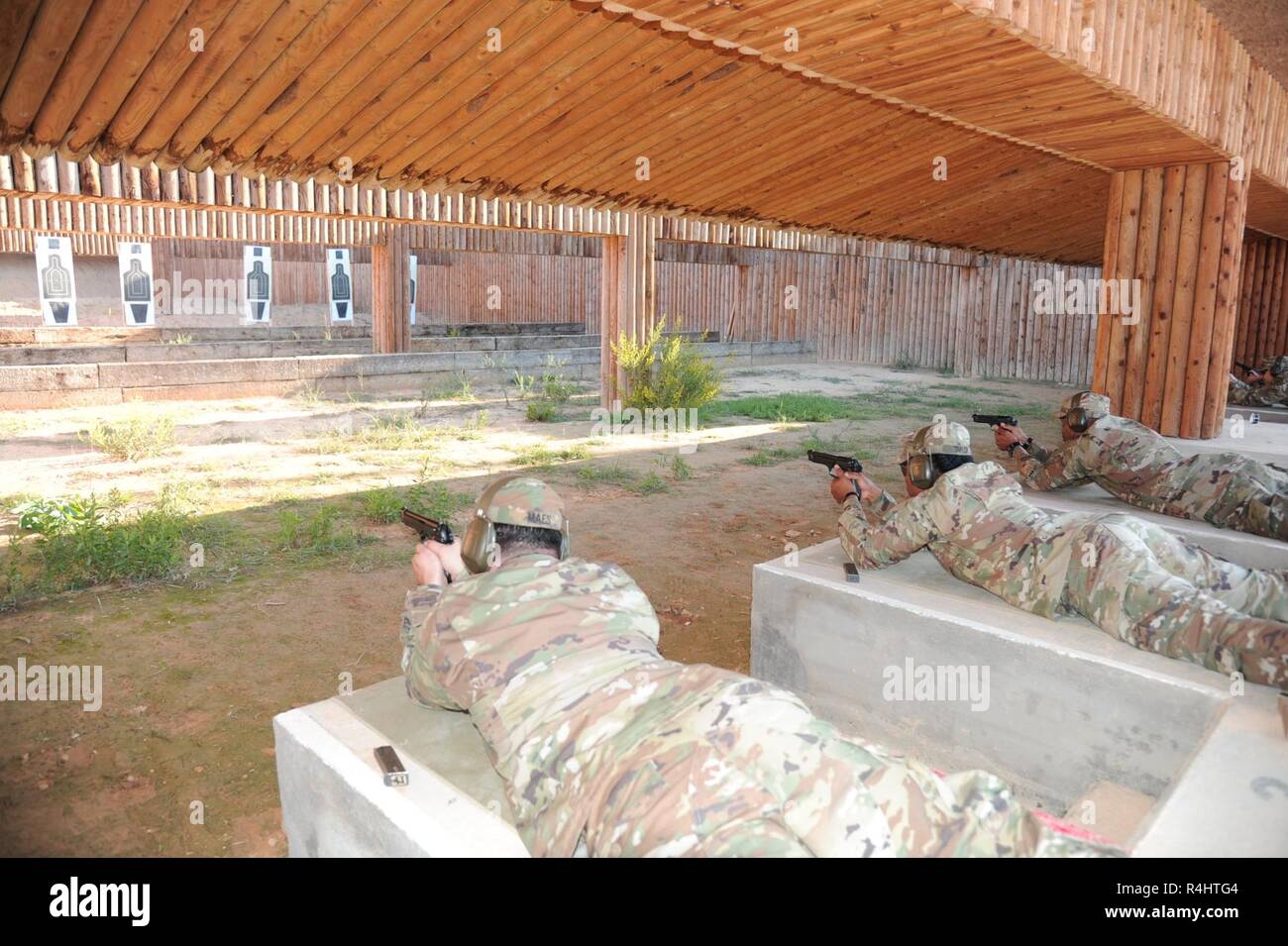 US Army Soldiers from NRDC Spain fire an M9 9mm pistol during ...