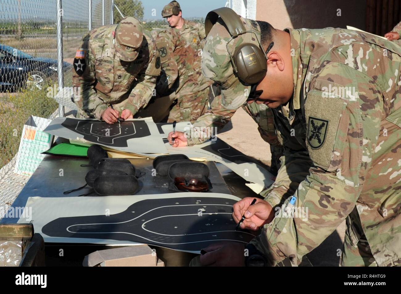 US Army Soldiers from NRDC Spain check the targets after qualification ...