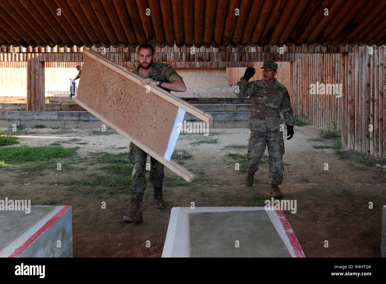 US Army Maj Alex Aquino from NRDC Spain and a Spanish Soldier from NRDC ...