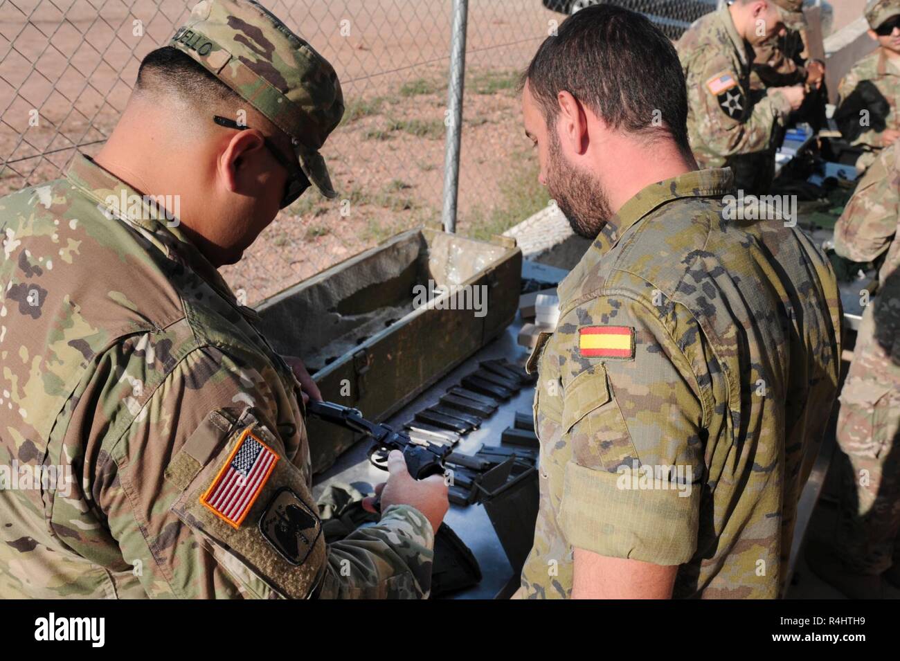 US Army Soldier from NRDC Spain and a Spanish Soldier from NRDC Spain ...