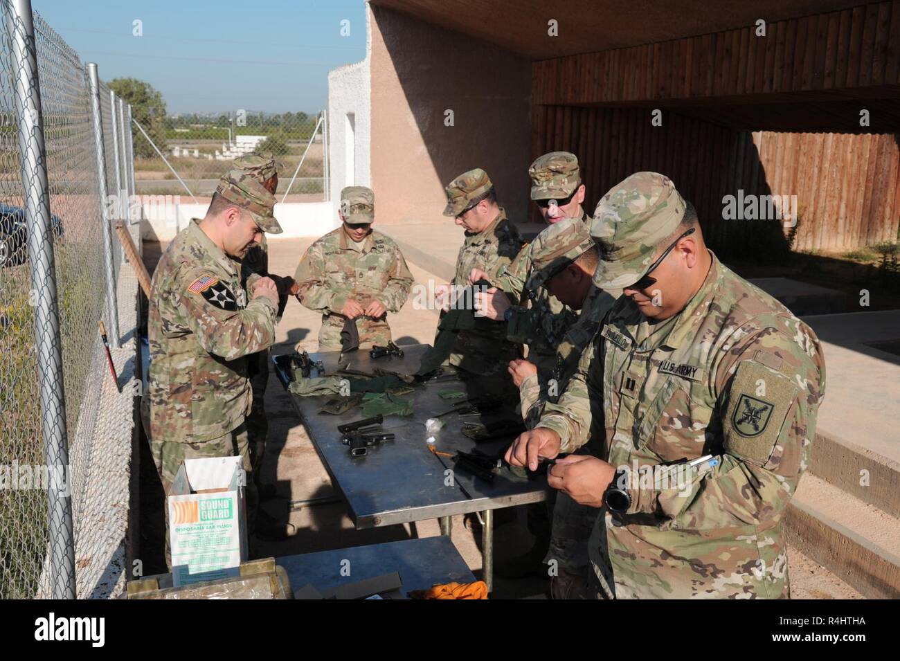 US Army Soldiers from NRDC Spain clean the M9 9mm pistols after the ...