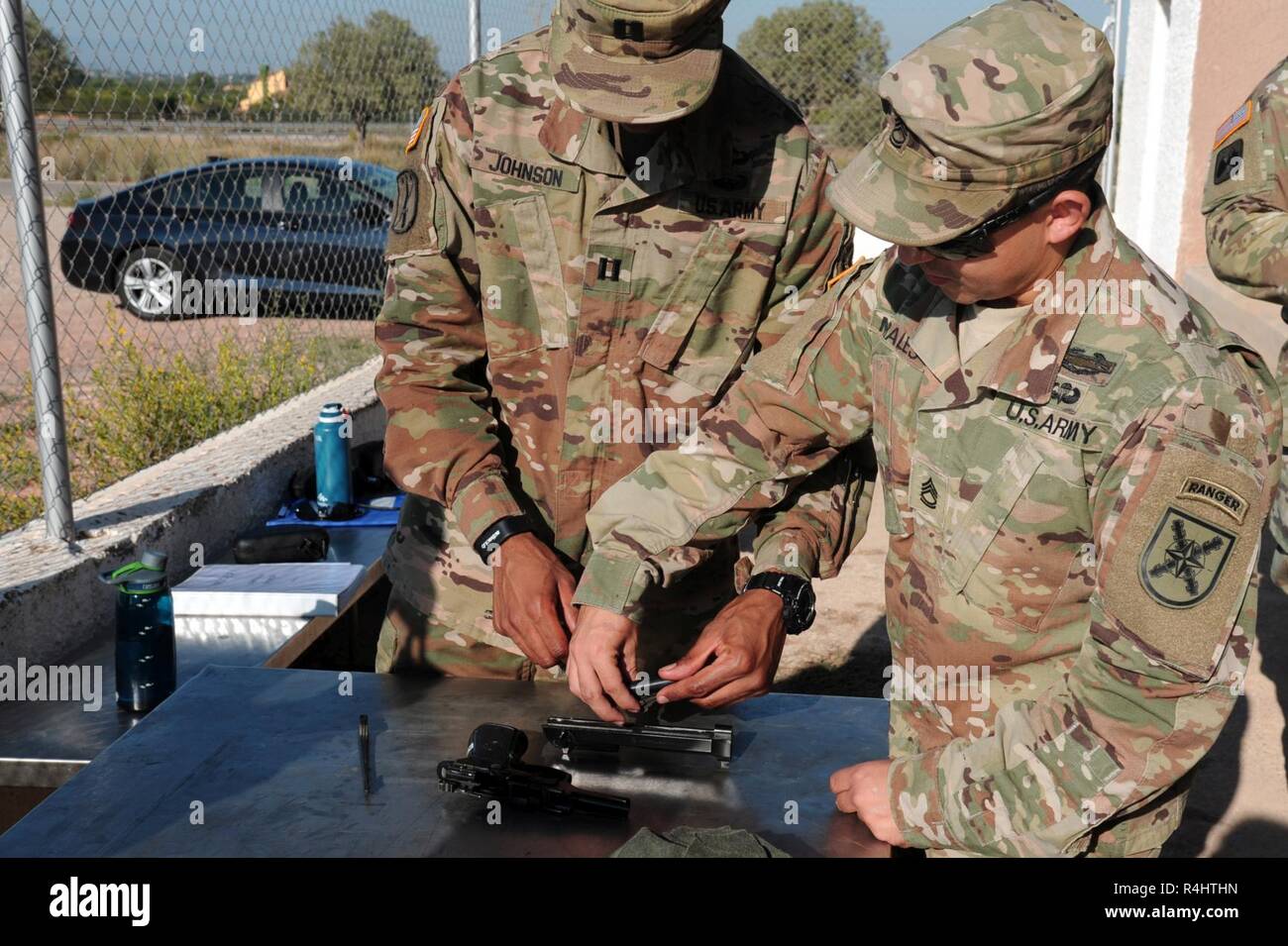 US Army Soldiers from NRDC Spain clean the M9 9mm pistols after the ...