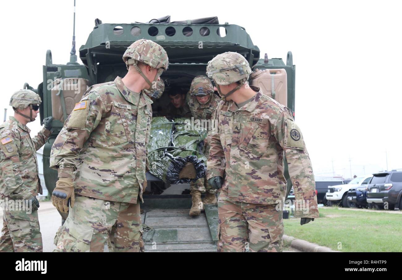 Soldiers with 3rd Cavalry Regiment practice unloading a patient from a ...