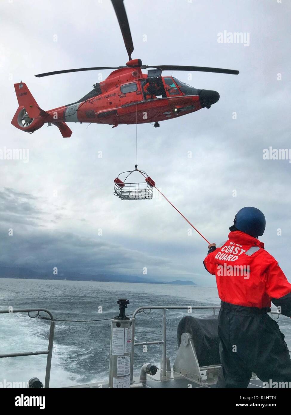 A member aboard a 64-foot Special Purpose Craft-Screening Vessel from ...