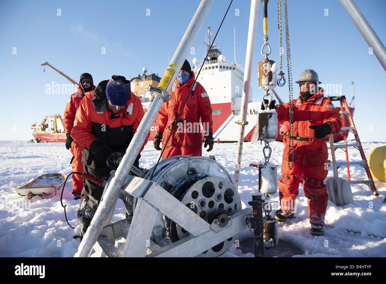 ARCTIC OCEAN – A group of scientists and engineers deploy an ice ...