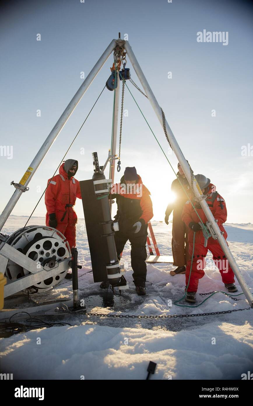 ARCTIC OCEAN – Scientists and engineers attach an ice tethered profiler ...