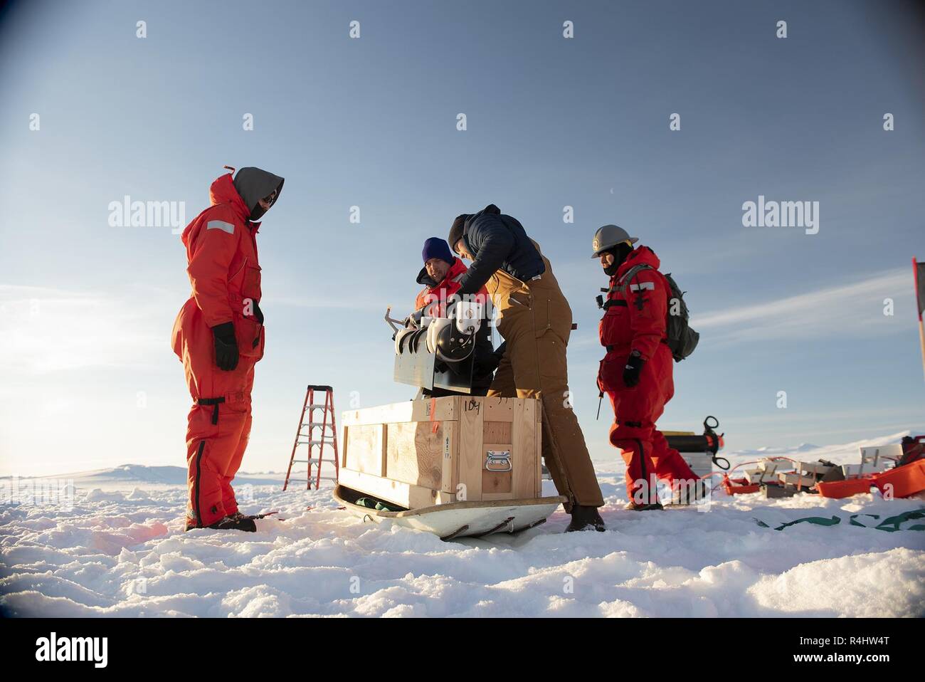 ARCTIC OCEAN – Scientists and engineers remove an ice tethered profiler ...