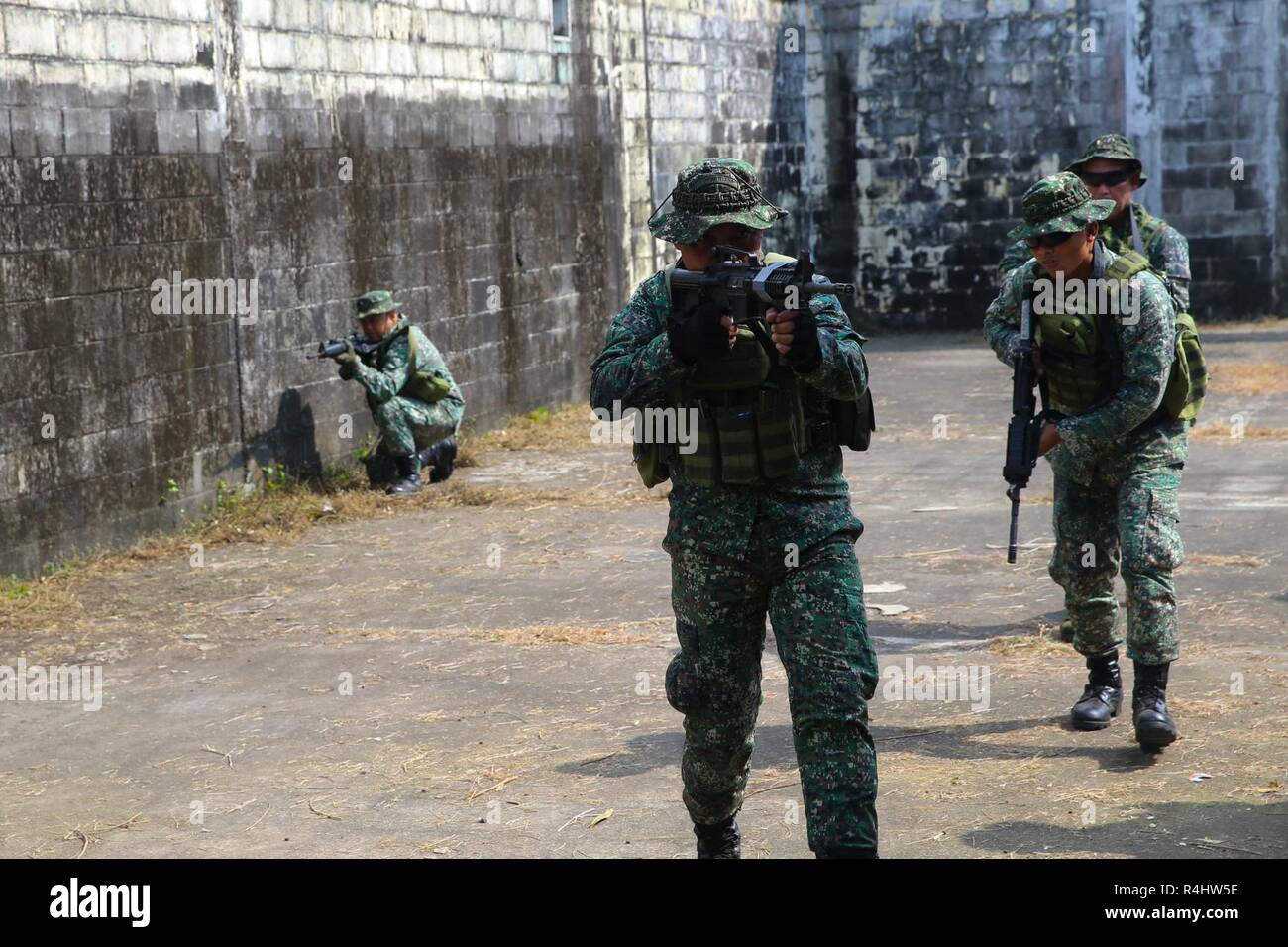 Philippine Marines conduct a room sweep as part of their military ...