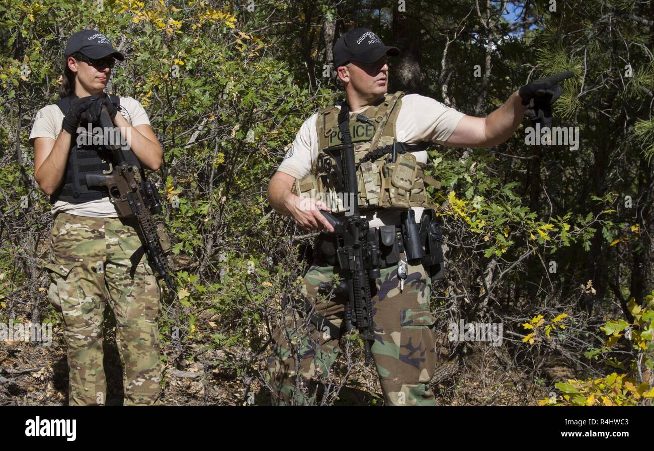 An officer from the Colorado Springs Police Department SWAT team keeps ...