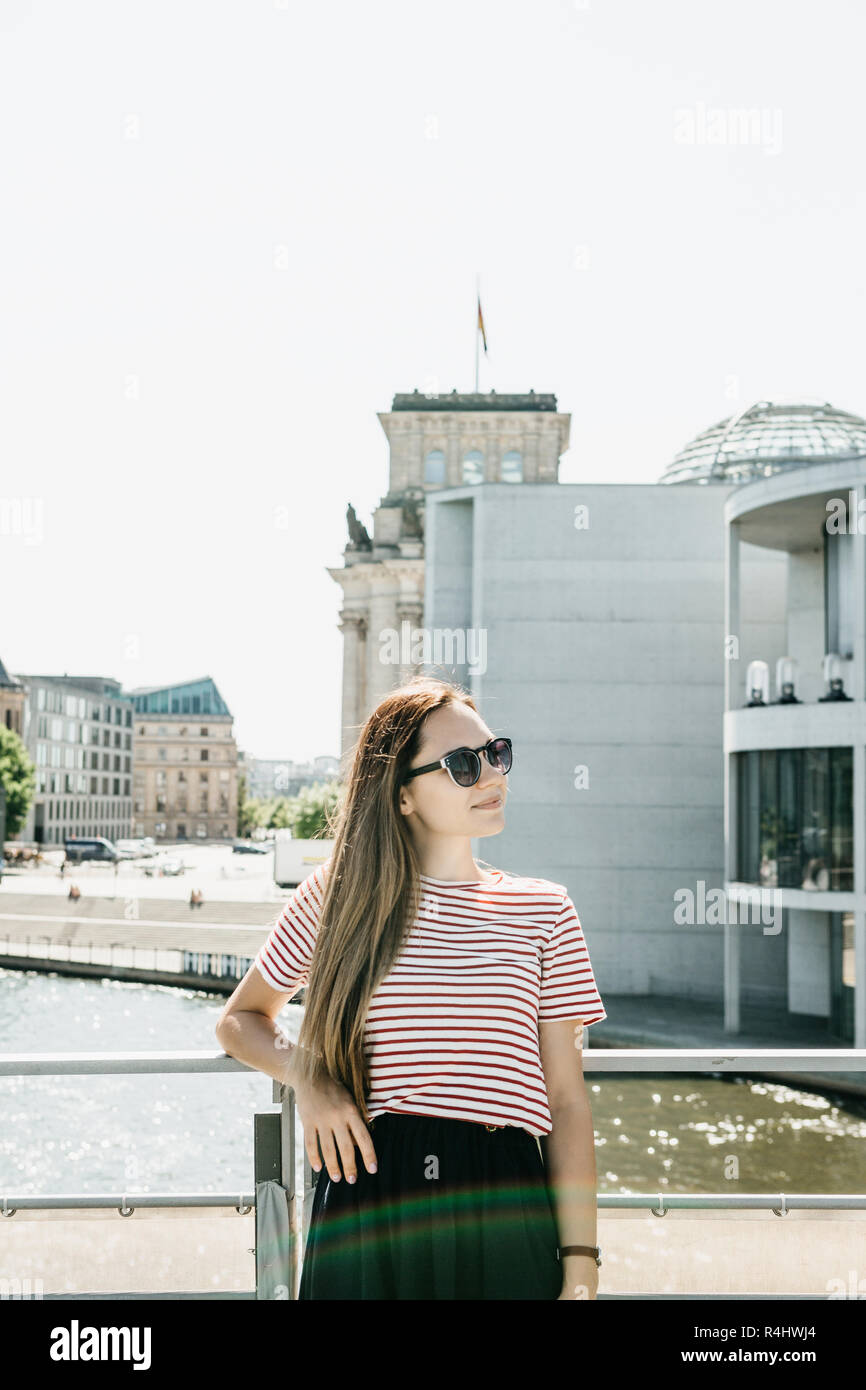 Portrait of a young beautiful girl on the street of Berlin. Lifestyle ...