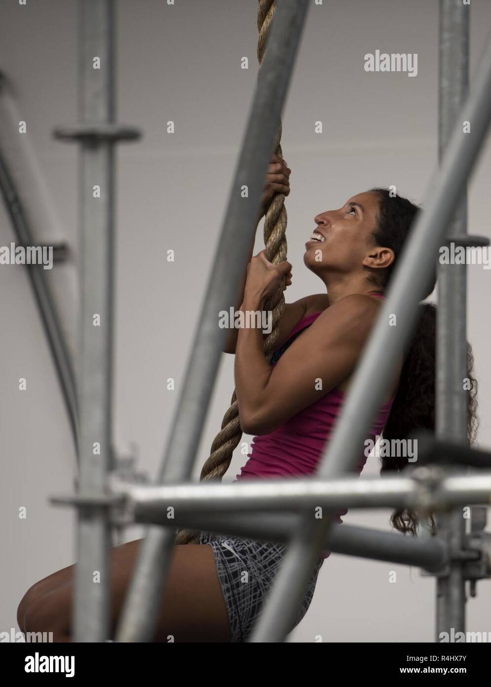 An Airman climbs a rope during the Alpha Warrior challenge, one of ...