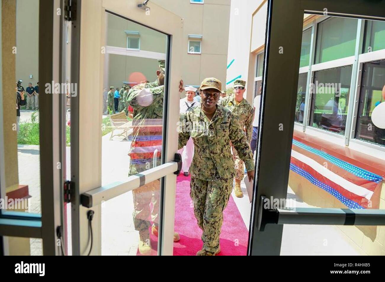 MANAMA, Bahrain (Sept. 30, 2018) Capt. Fisher opens the door for CSCS ...