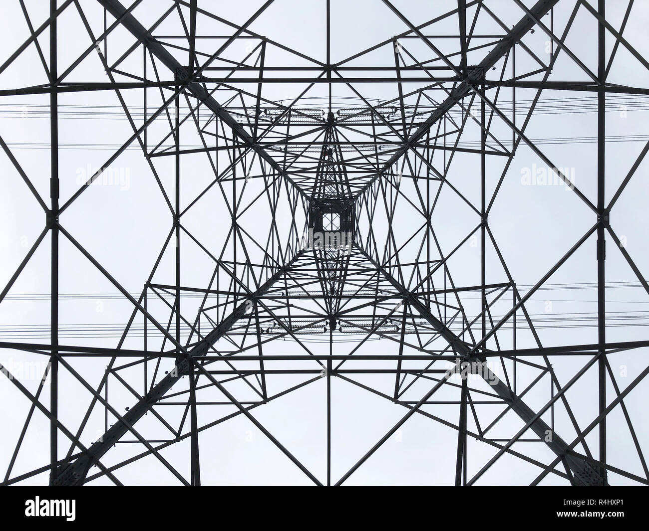 Power line tower viewed from above. Geometrical structure. Energy ...