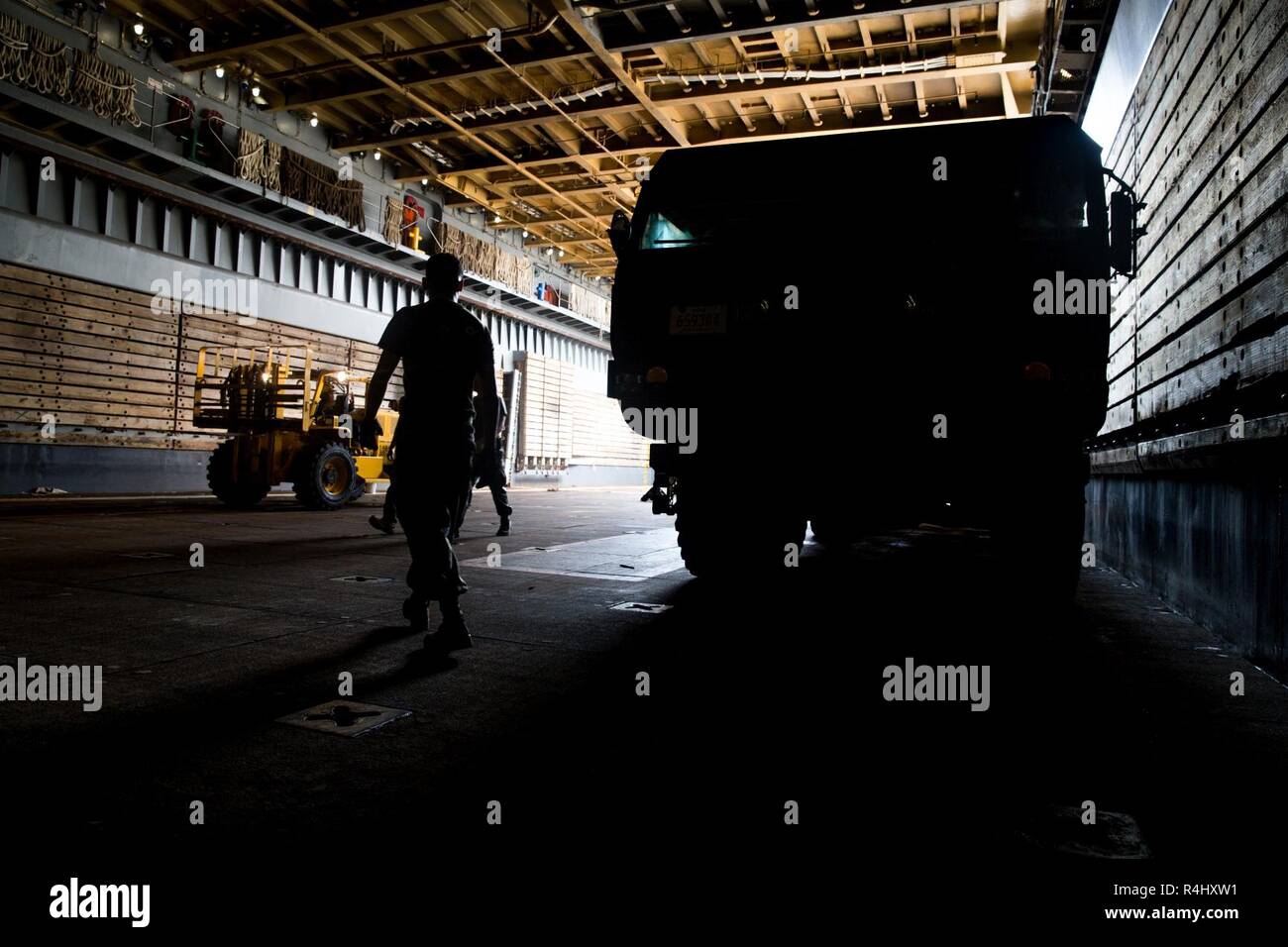 Marines with Combat Logistics Battalion 31 prepare to move a low bed ...