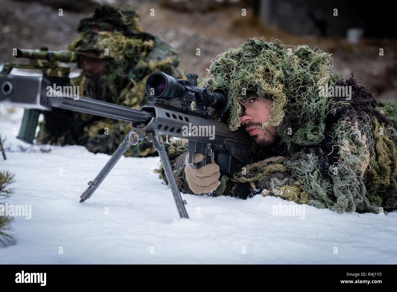 A sniper and his spotter of the Spanish Lepanto Battalion line up their ...