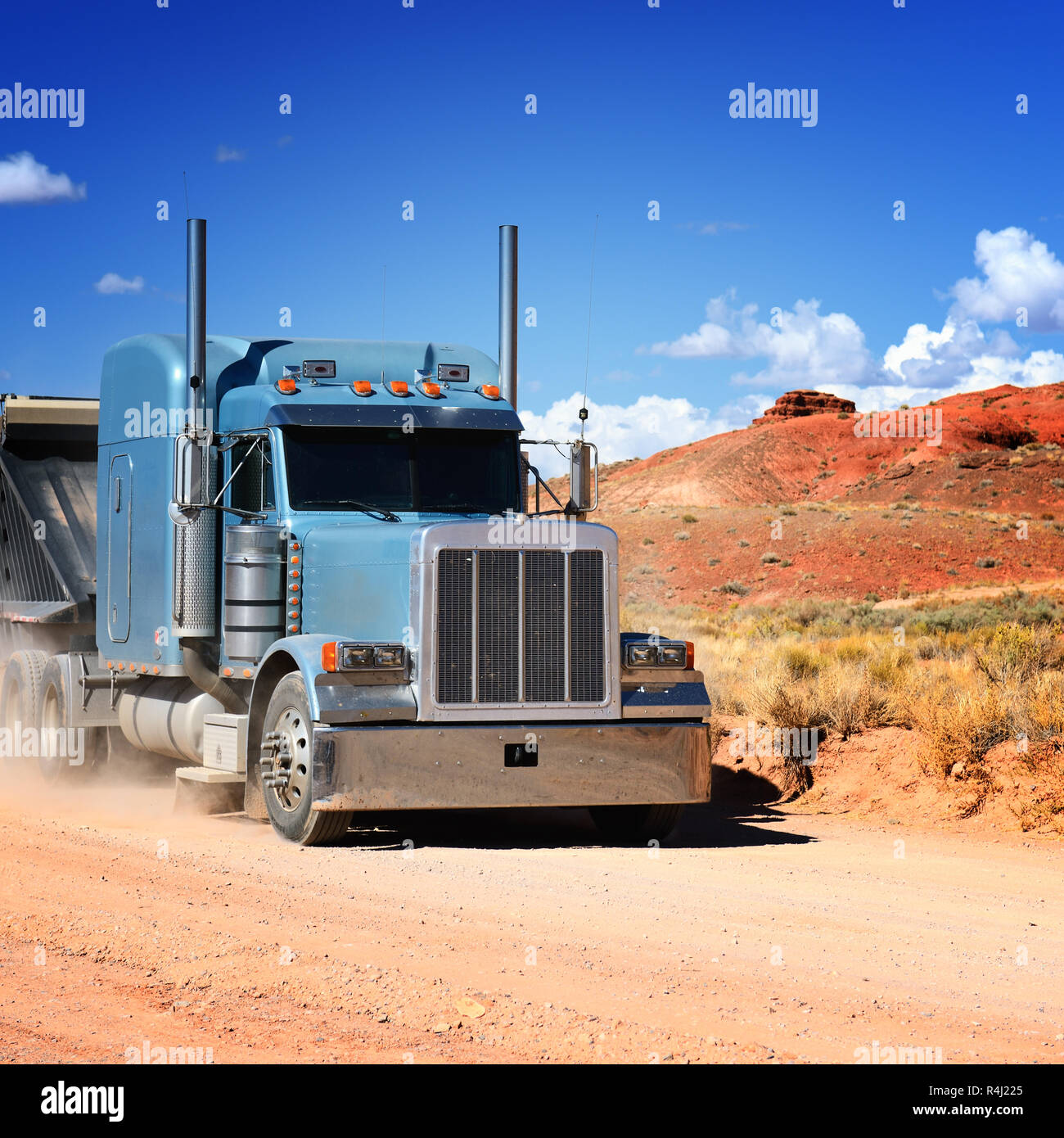 Semi-truck driving across the desert Stock Photo - Alamy
