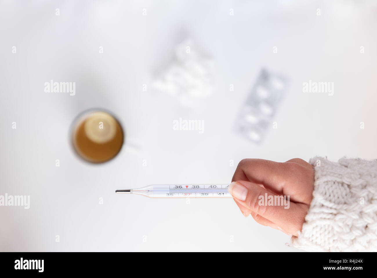 Close up of traditional thermometer for measuring body temperature in ...
