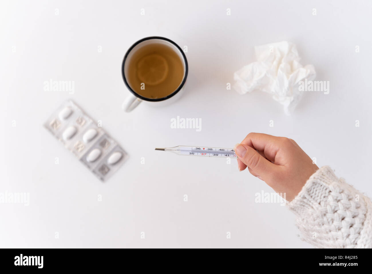 Close up of traditional thermometer for measuring body temperature in ...