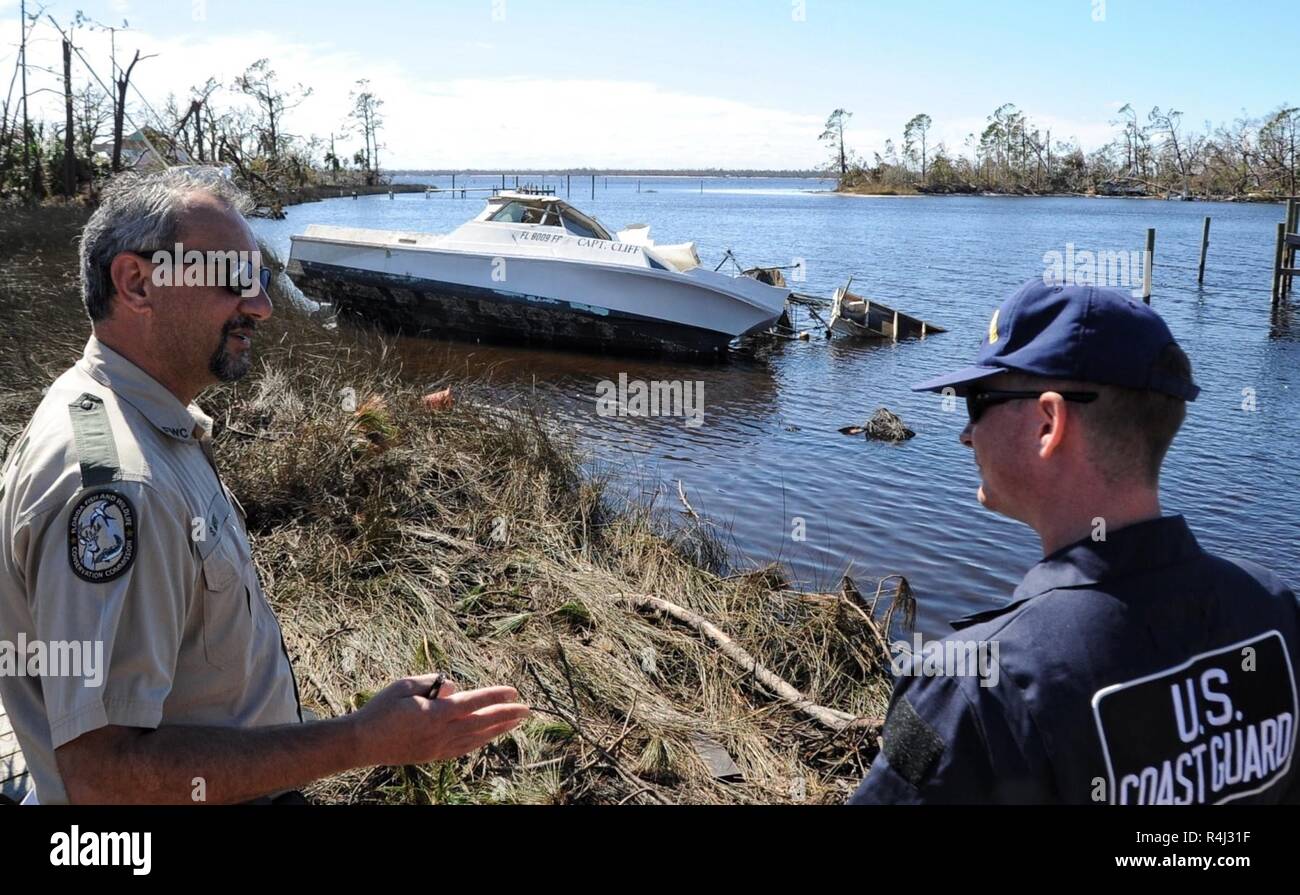FWC Investigator II Serdar Mert and Coast Guard Petty Officer 2nd Class ...