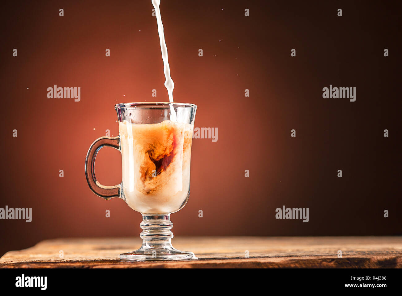 Adding milk to a cup of tea Stock Photo - Alamy